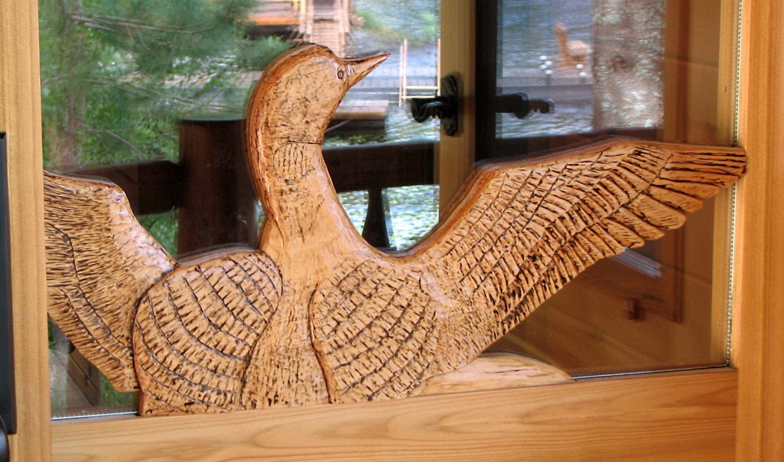 A Custom Cedar Entry Door, Carved Loon - Huisman Concepts