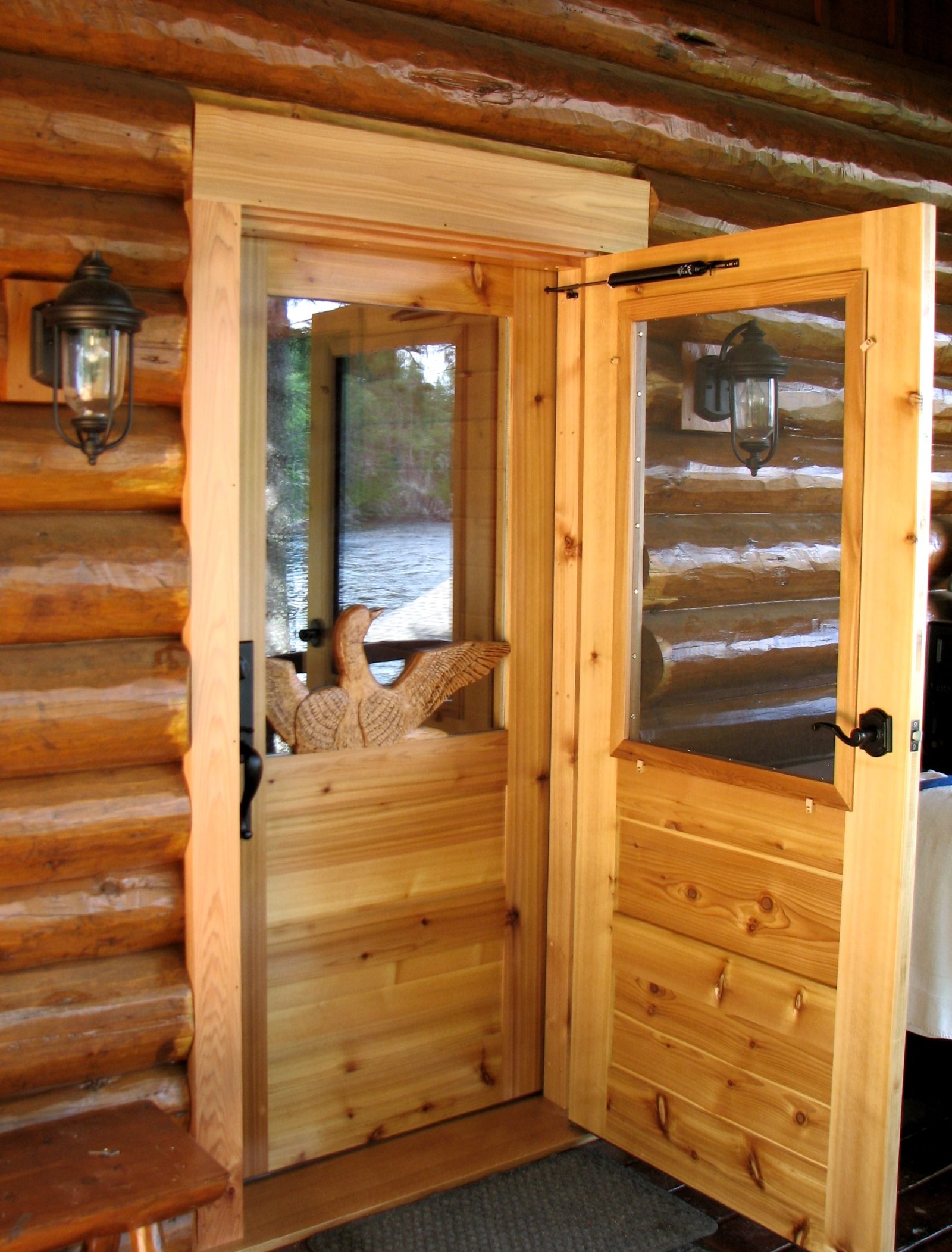 A Custom Cedar Entry Door, Carved Loon - Huisman Concepts