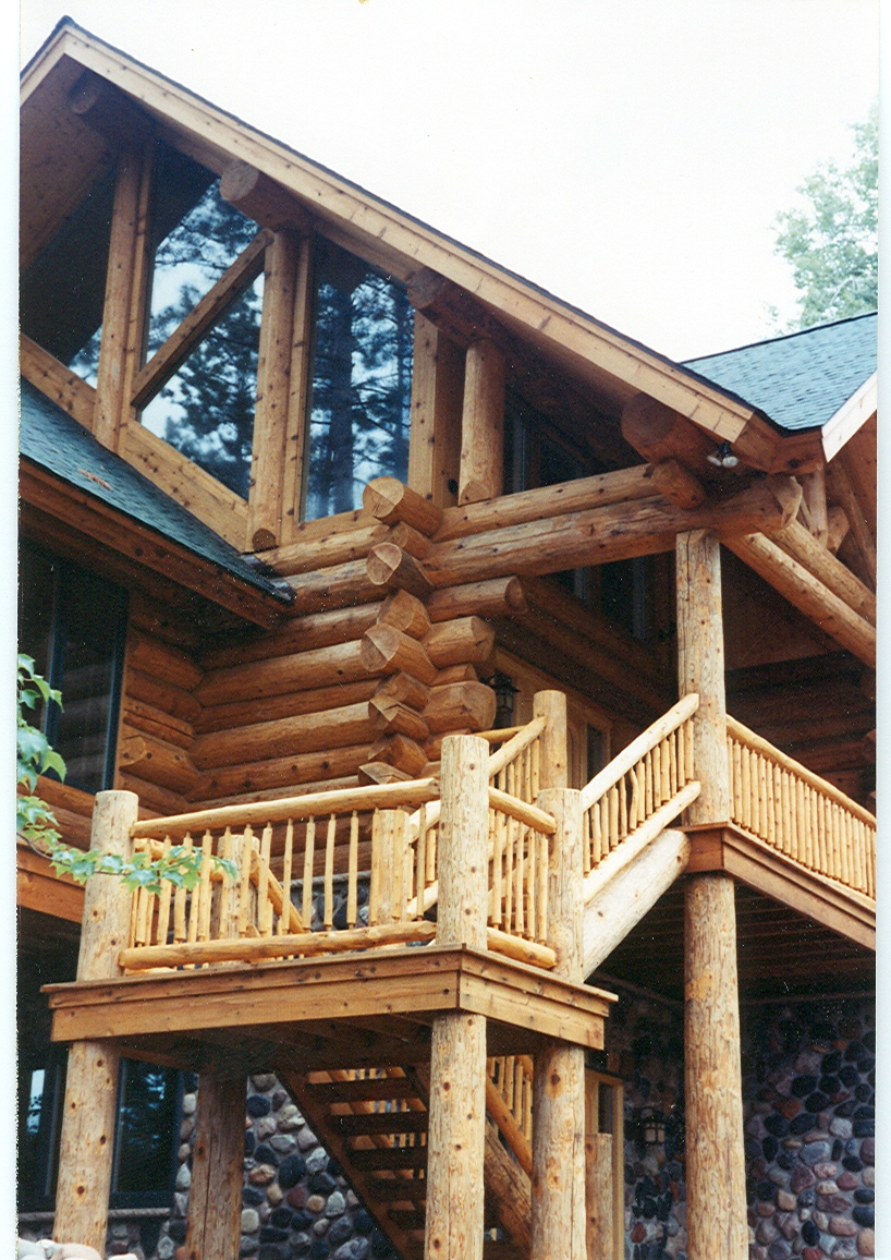 Large Log Home, Stone and Cedar Logs - Huisman Concepts